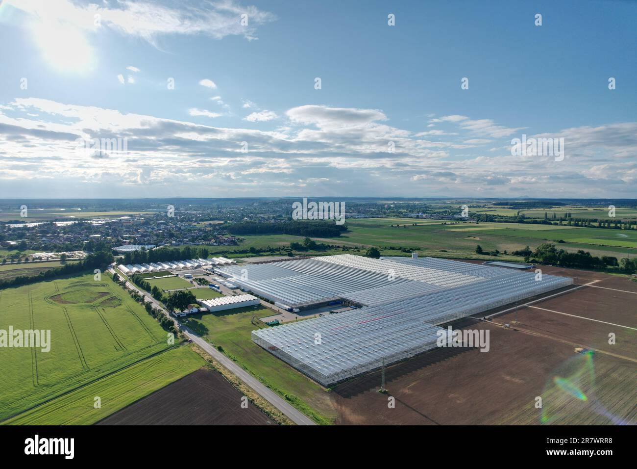 Glass greenhouses from above in sunny weather, big glass houses from ...
