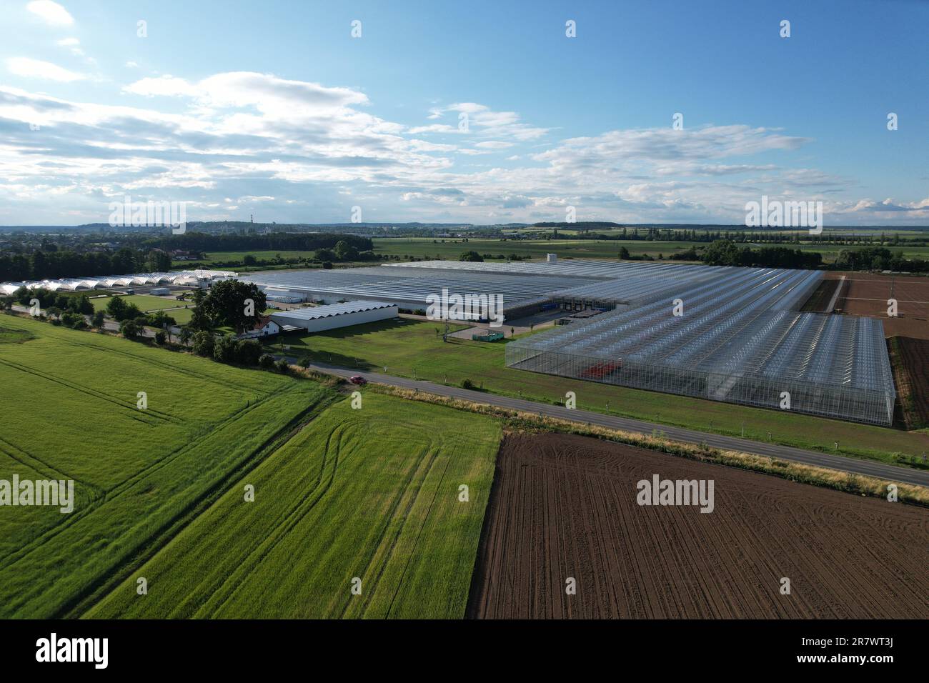 Glass greenhouses from above in sunny weather, big glass houses from ...