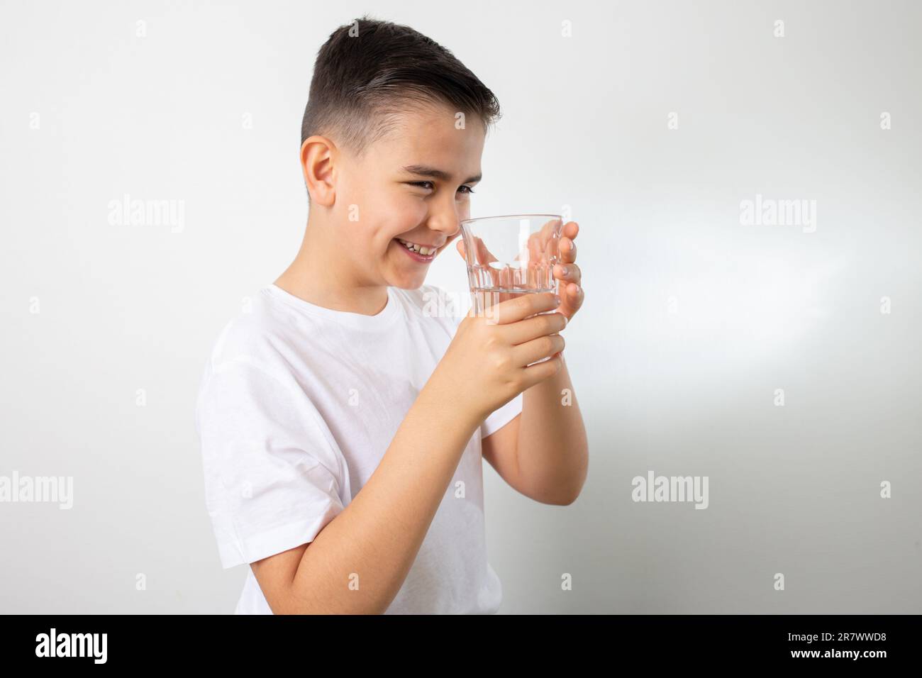 boy with a glass of water, smiling Stock Photo - Alamy