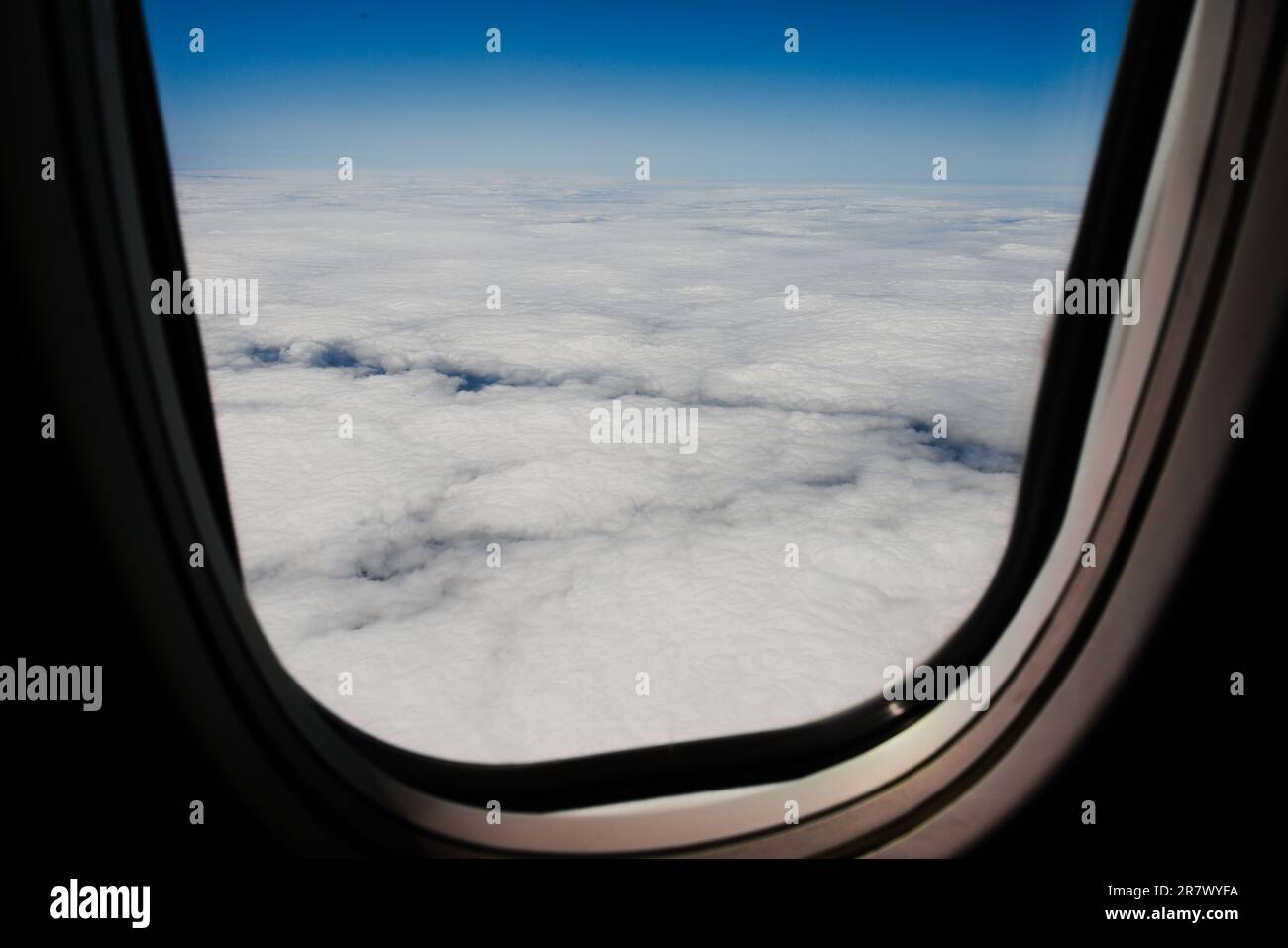 View from airplane window. Oval portal to the outside world. High ...