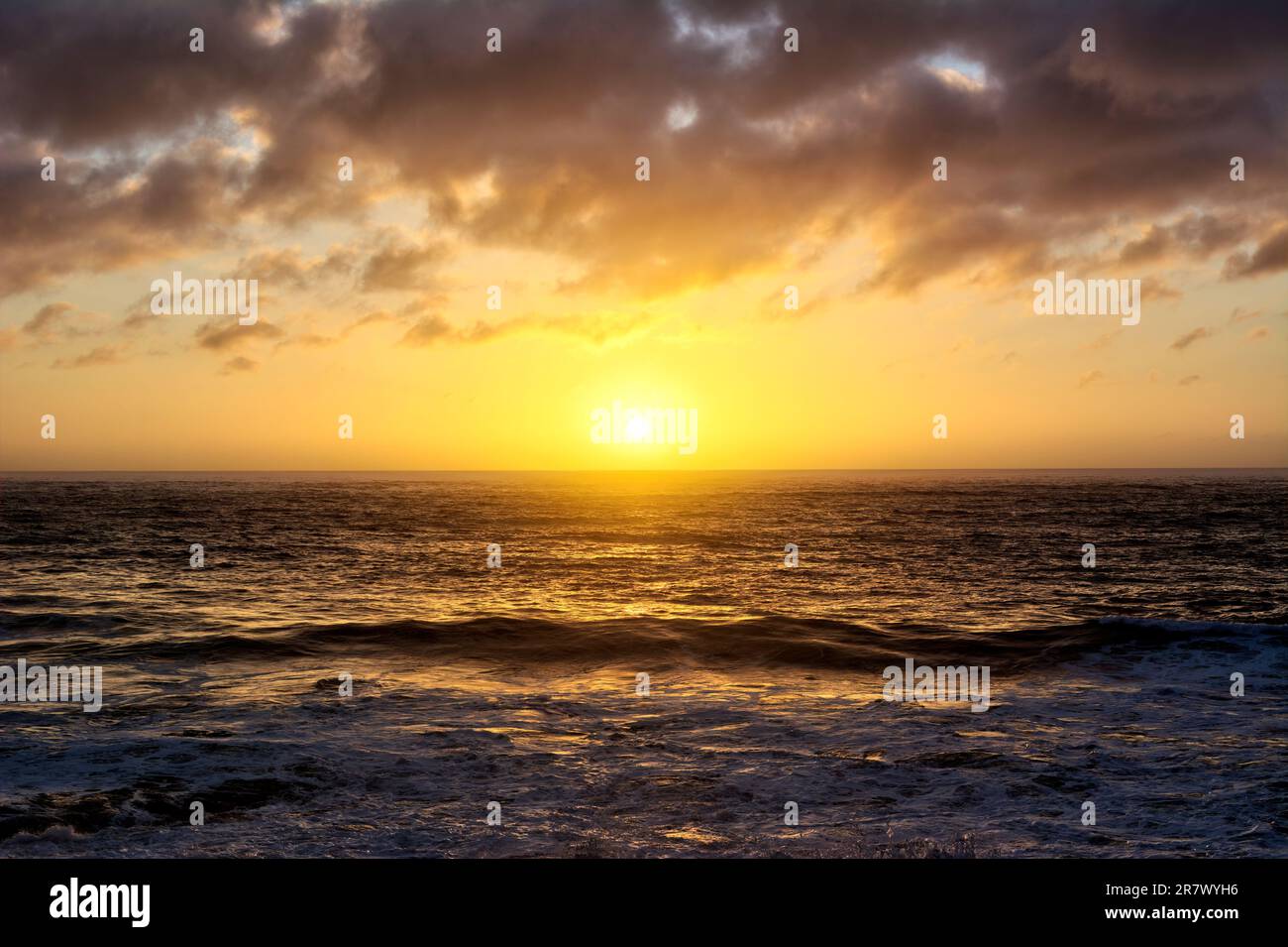 A stunningly beautiful sunset over the Pacific Ocean on the coast of ...