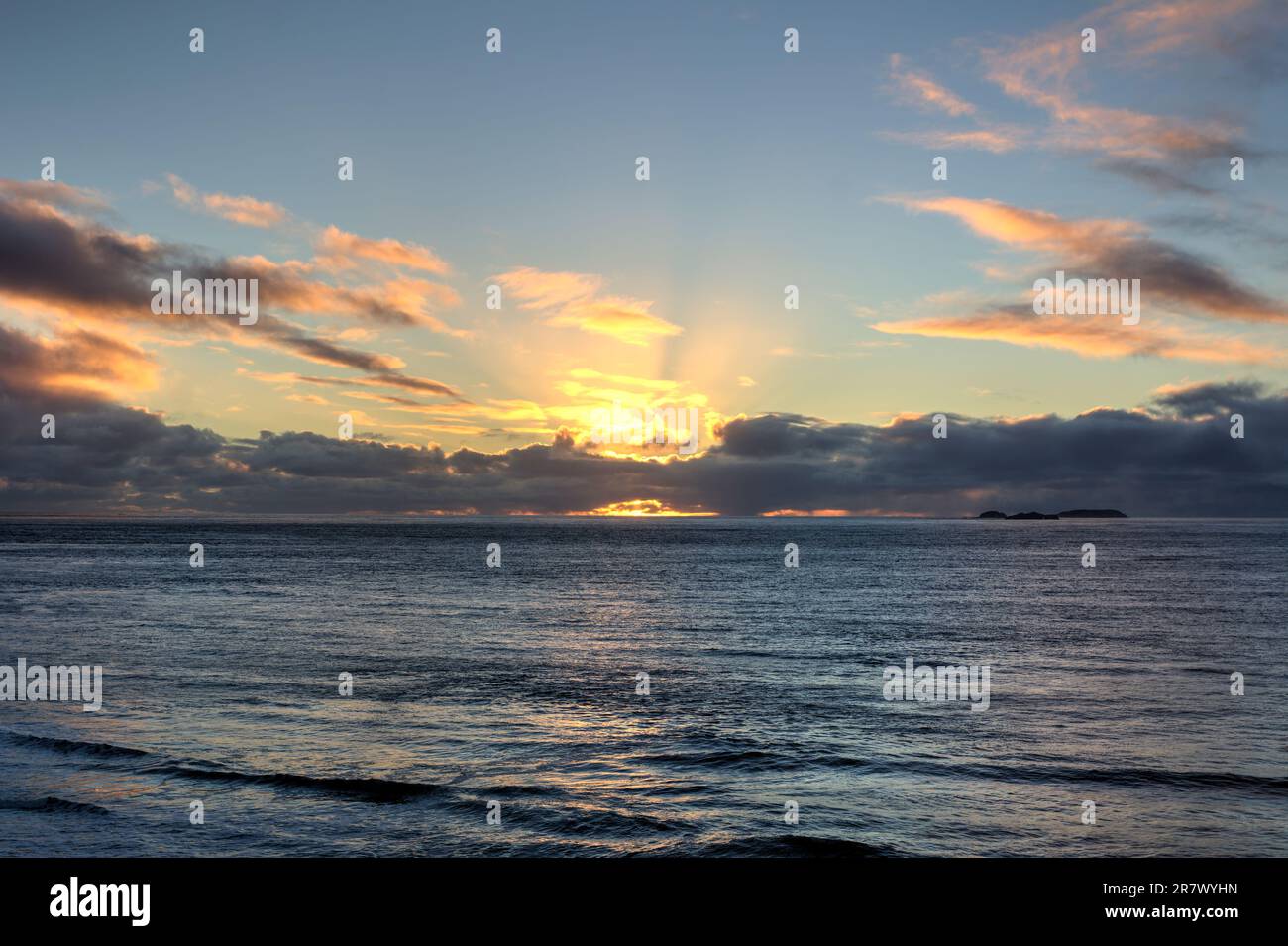 A stunningly beautiful sunset over the Pacific Ocean on the coast of ...
