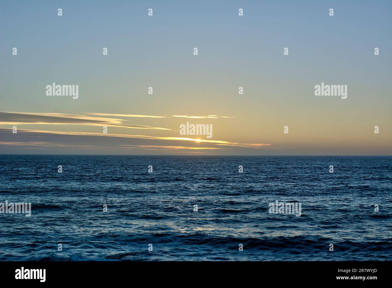 A stunningly beautiful sunset over the Pacific Ocean on the coast of ...