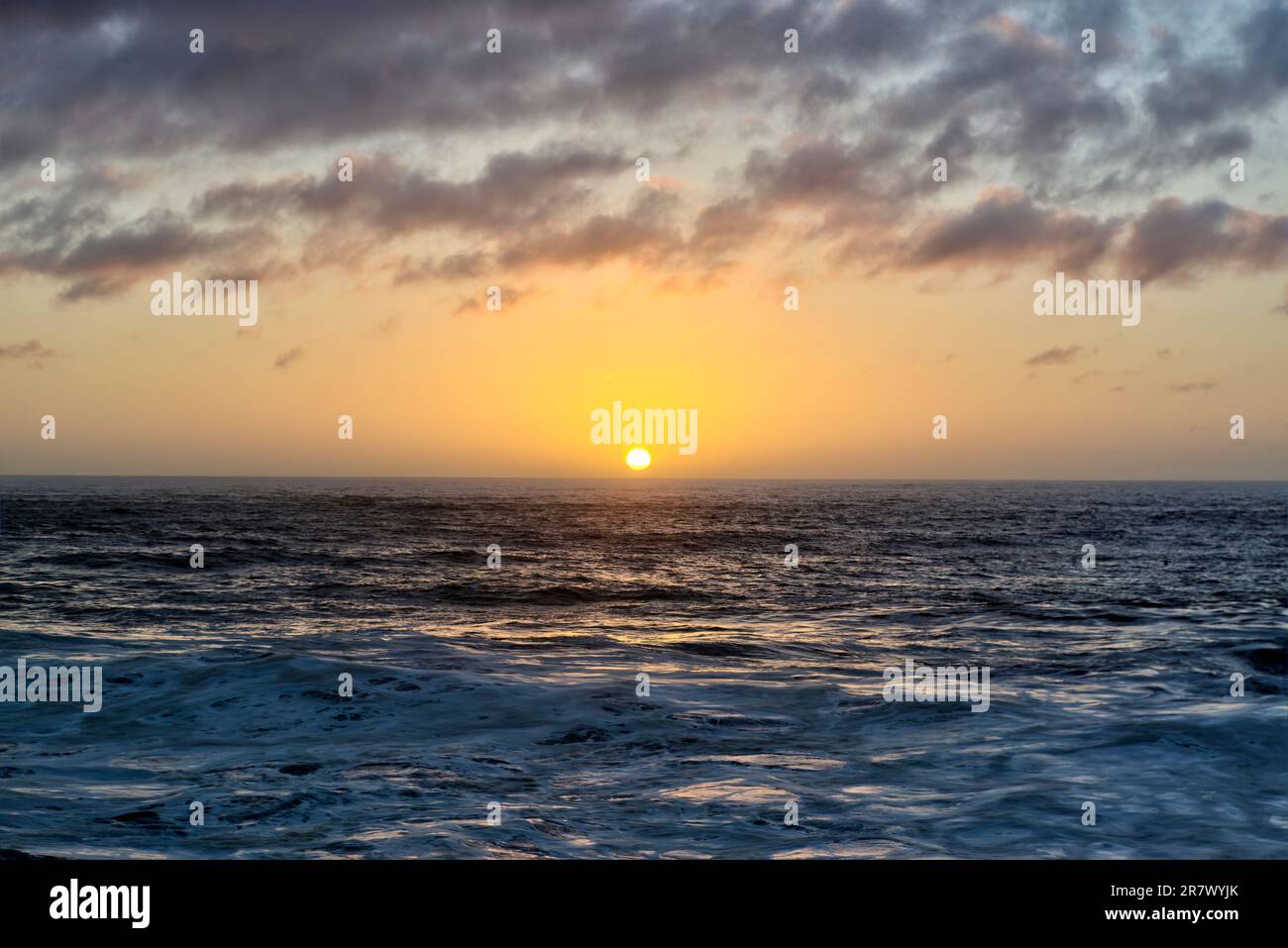 A stunningly beautiful sunset over the Pacific Ocean on the coast of ...