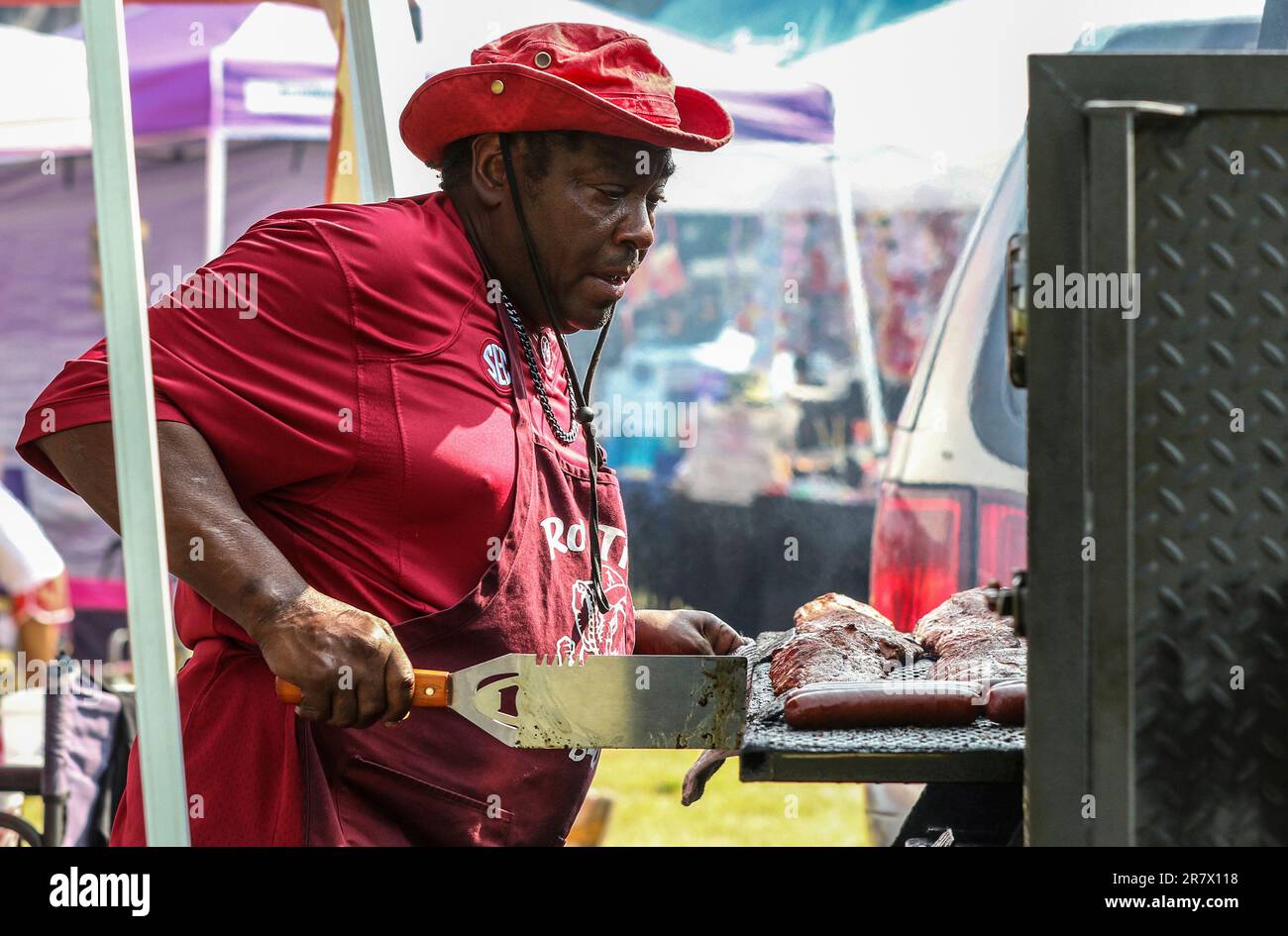 Greg Wallace with Roll Tide BBQ checks on his hot dogs, pulled pork and ...
