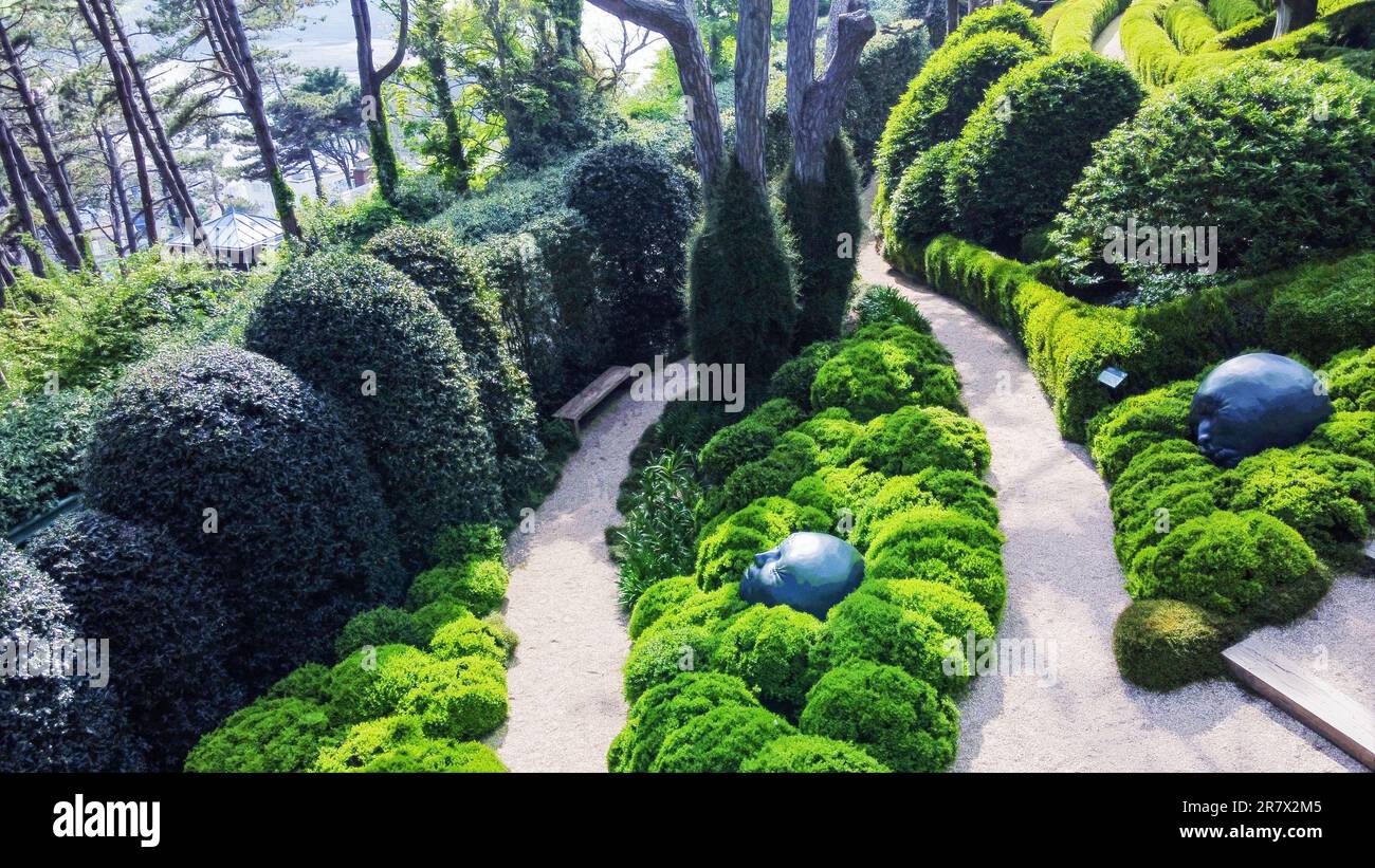 05-17-2023 Etretat , France. Etretat gardens with topiary plants and ...