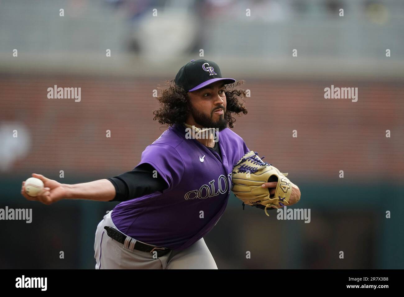 Colorado Rockies relief pitcher Justin Lawrence (61) delivers during a ...