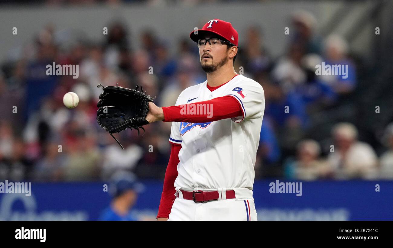 Texas Rangers starting pitcher Dane Dunning receives the ball during ...