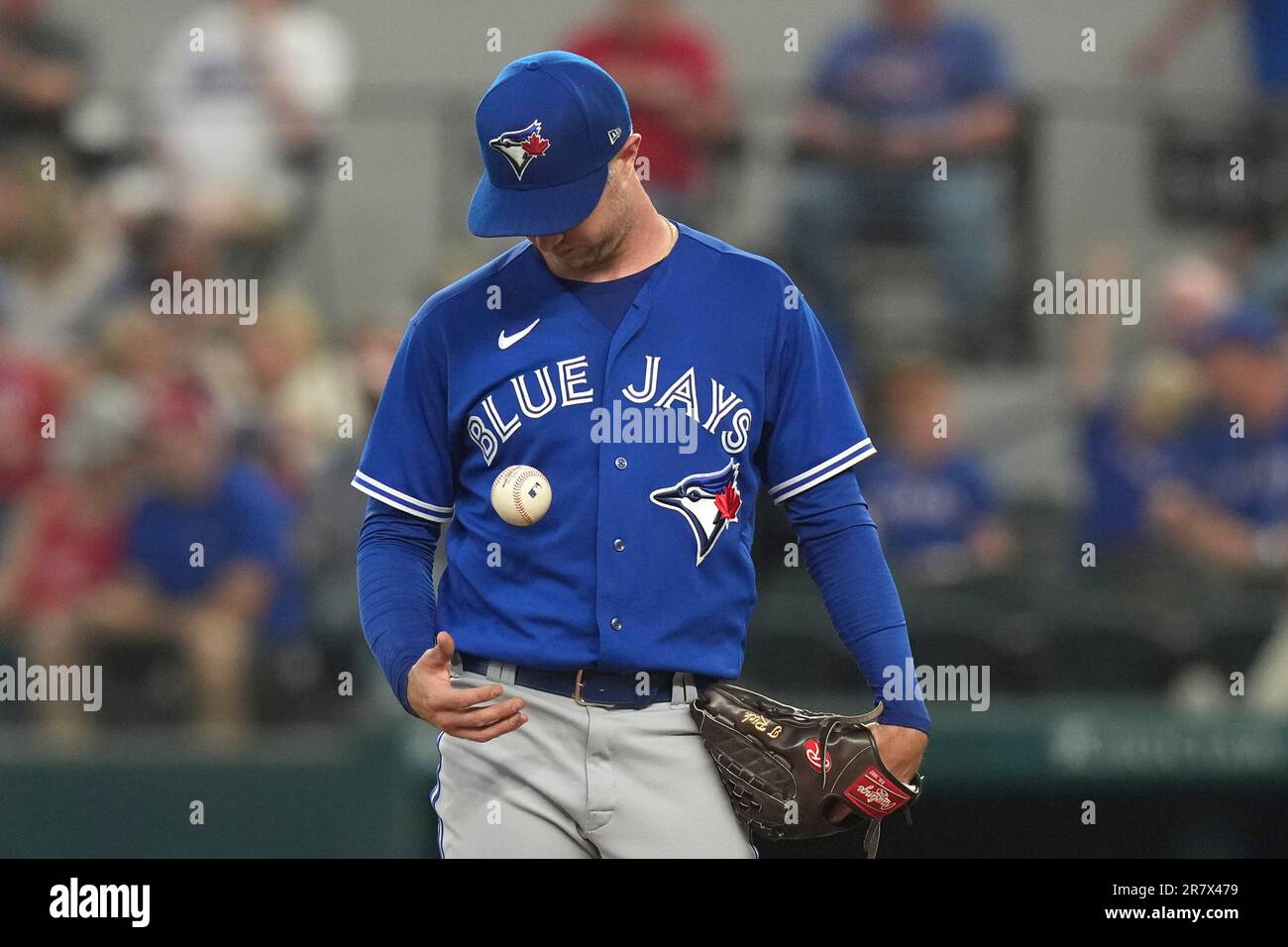 Toronto Blue Jays starting pitcher Trevor Richards tosses the game ball ...