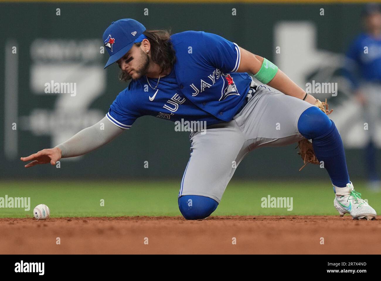Toronto Blue Jays shortstop Bo Bichette reaches for a ball a fielding ...