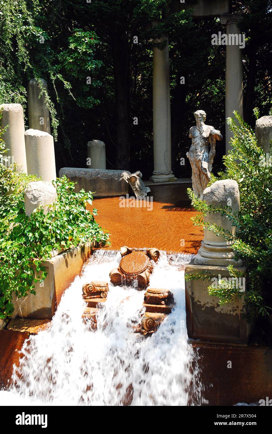 A water flows from a fountain decorated in an Ancient Roman theme Stock ...