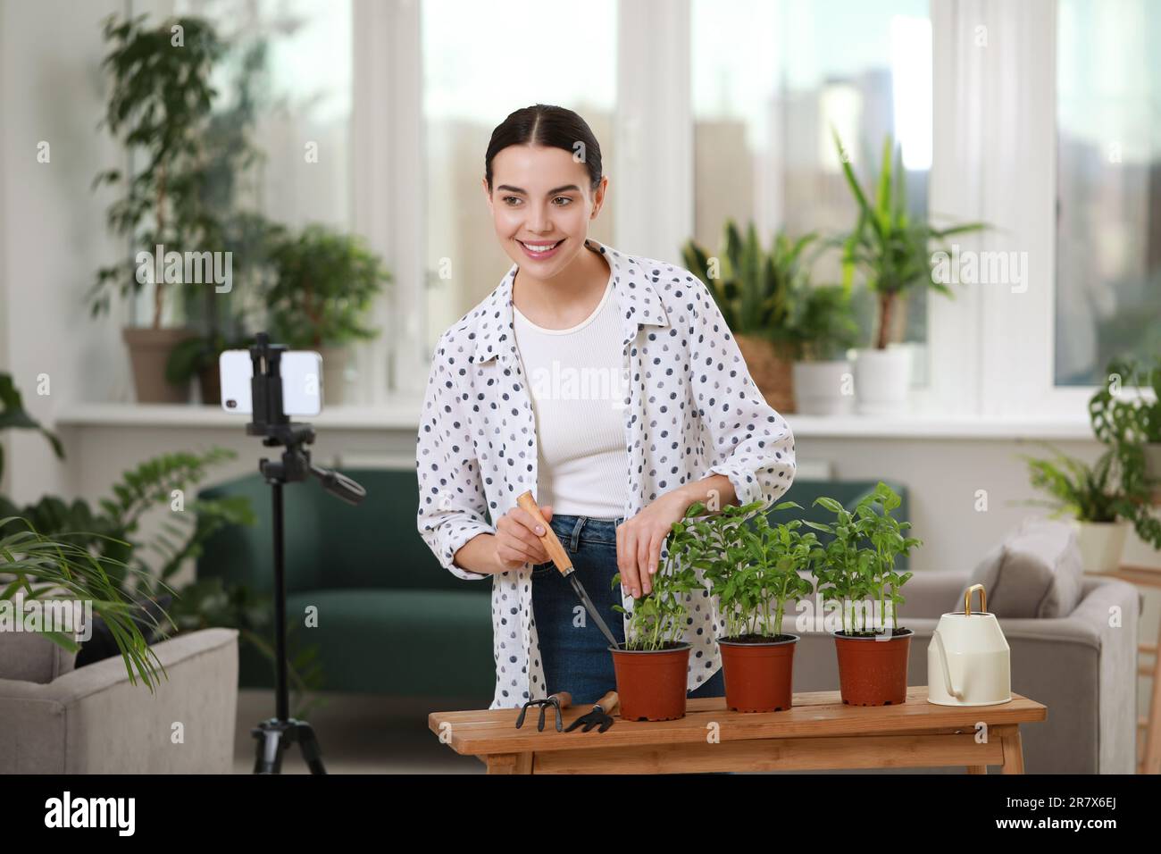 Teacher conducting online gardening course at home. Time for hobby ...