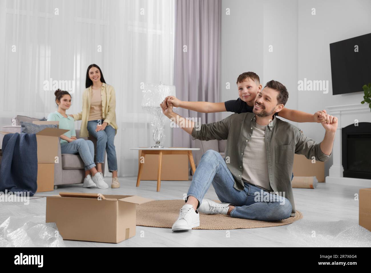 Happy family children moving hi-res stock photography and images - Alamy