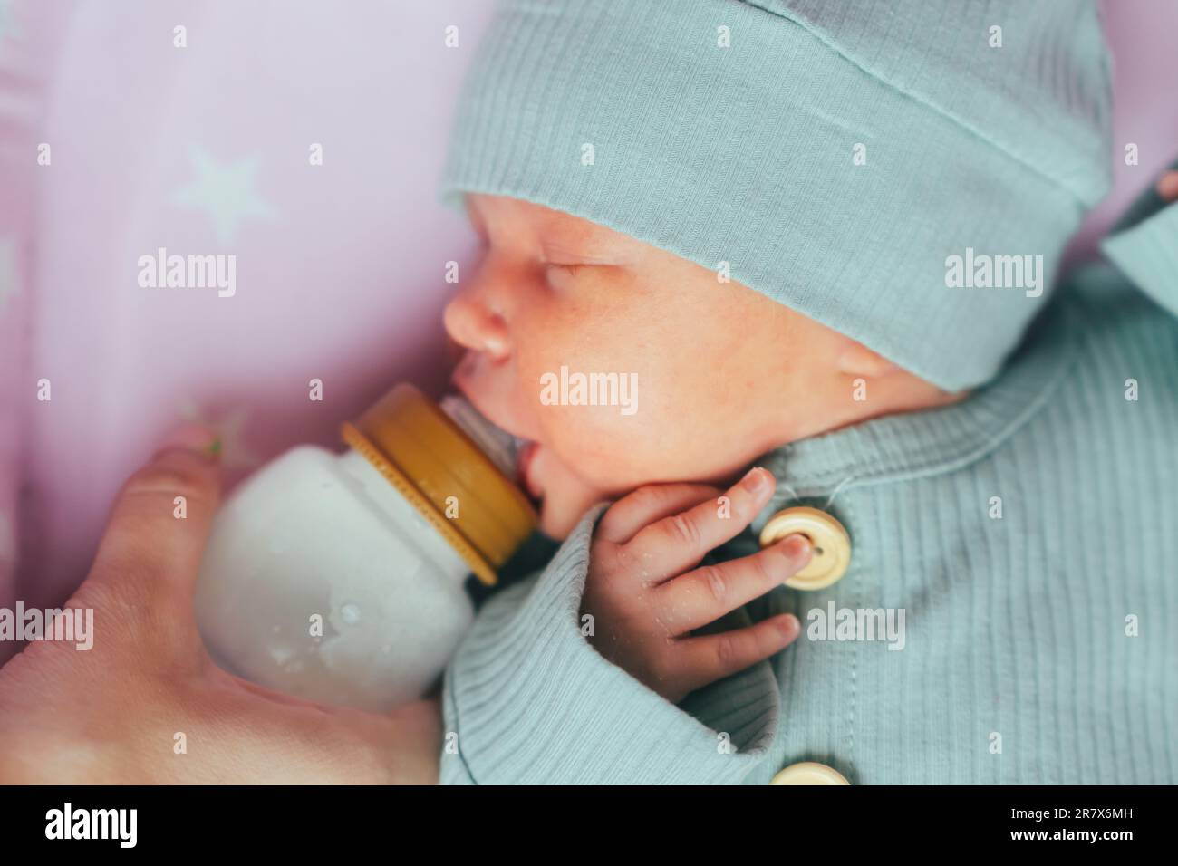 newborn baby crying lying in the crib. New born child tired and hungry in bed Stock Photo - Alamy