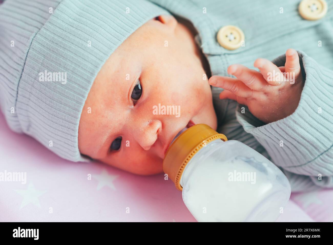 newborn baby crying lying in the crib. New born child tired and hungry ...