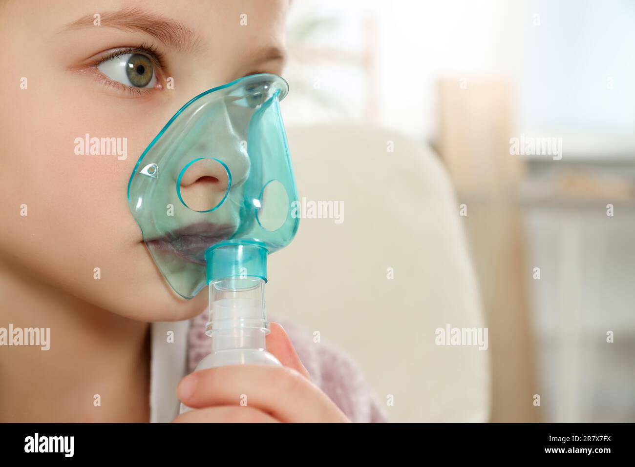 Little girl using nebulizer for inhalation indoors, closeup Stock Photo ...