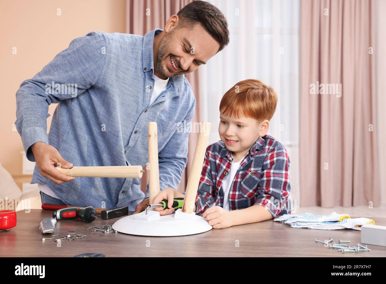 Boy making housework hi-res stock photography and images - Alamy