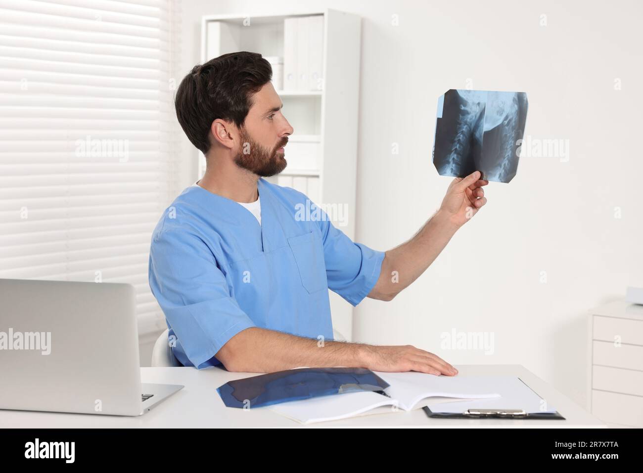 Doctor examining neck MRI scan in hospital Stock Photo - Alamy