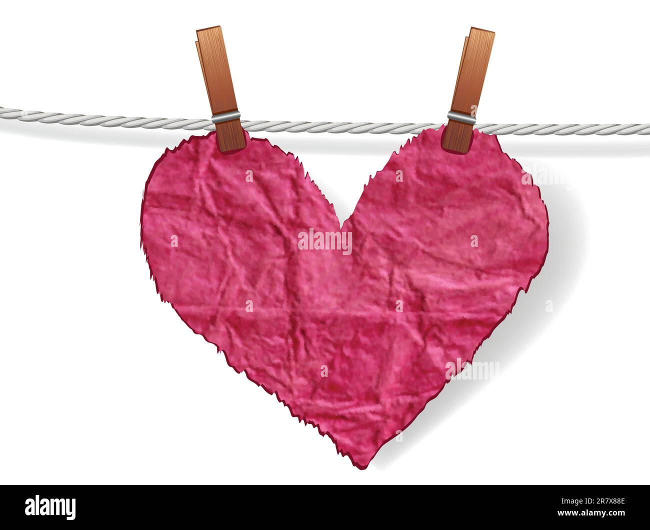 Heart crumpled ragged attached to a clothesline with pin. Love concept ...