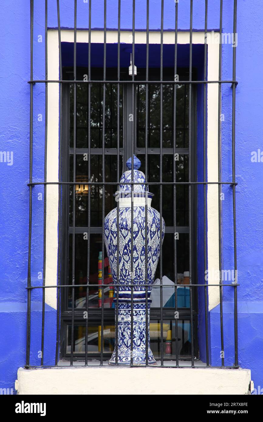 Blue building with beautiful window and steel grilles Stock Photo - Alamy