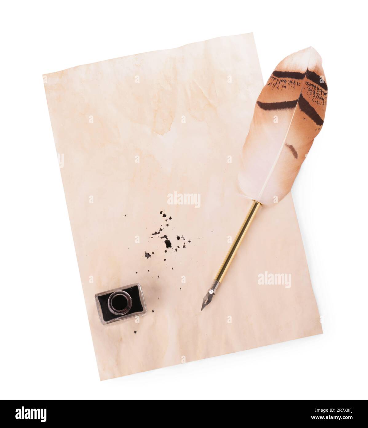 Parchment with stains of ink, feather pen and inkwell on white ...