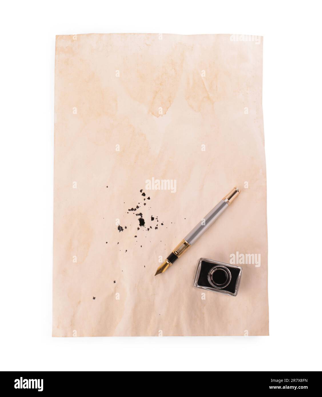 Parchment with stains of ink, fountain pen and inkwell on white ...