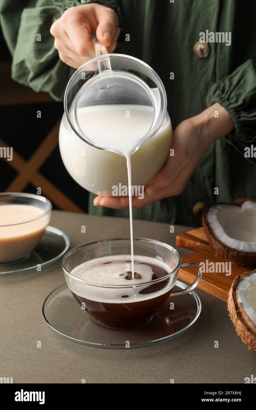 Woman pouring tasty coconut hi-res stock photography and images - Alamy