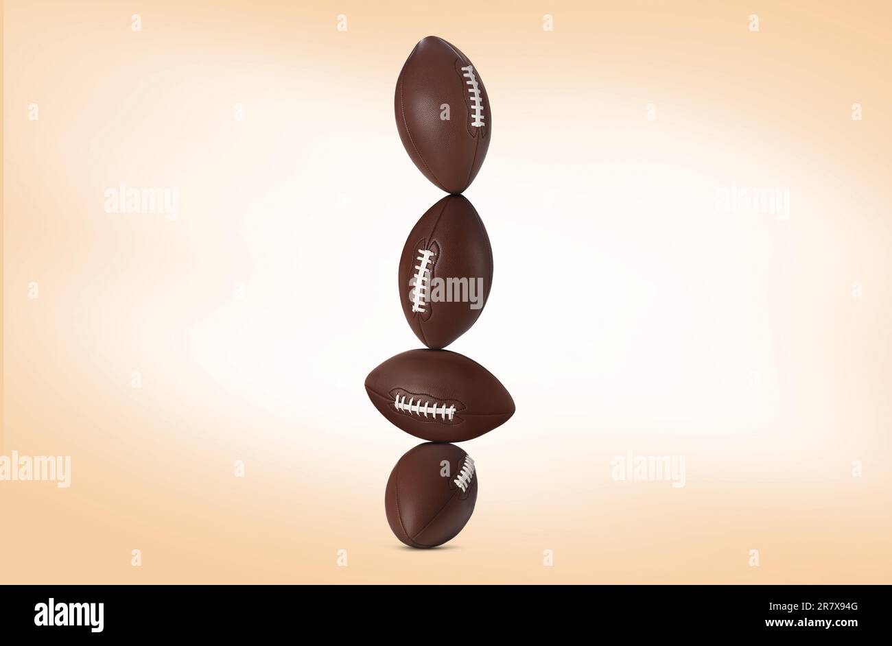 Stack of rugby balls on beige background Stock Photo - Alamy
