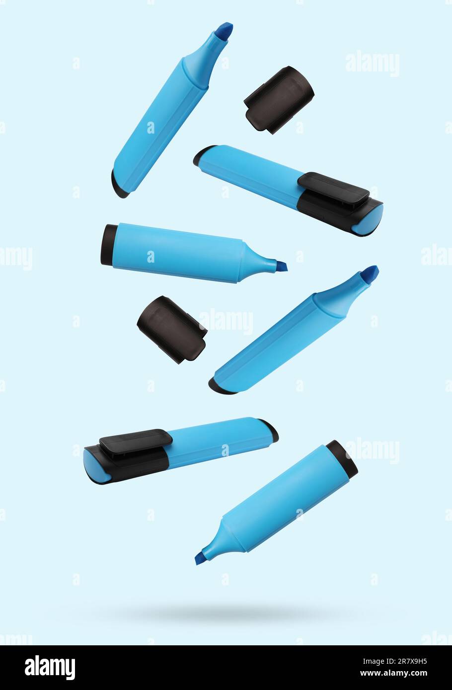 Many cyan markers falling on light background Stock Photo - Alamy