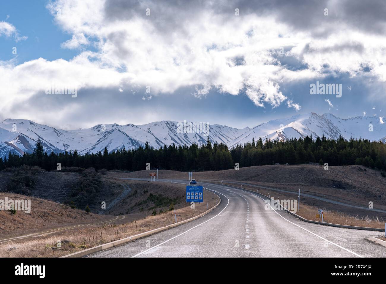 A scenic landscape of road to Aoraki Mount Cook - Lake Pukaki with blue ...