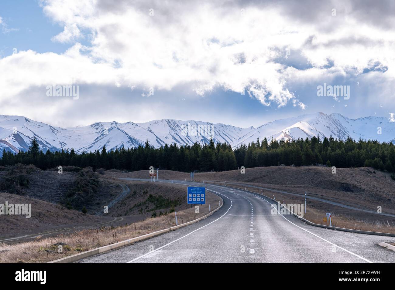 A scenic landscape of road to Aoraki Mount Cook - Lake Pukaki with blue ...