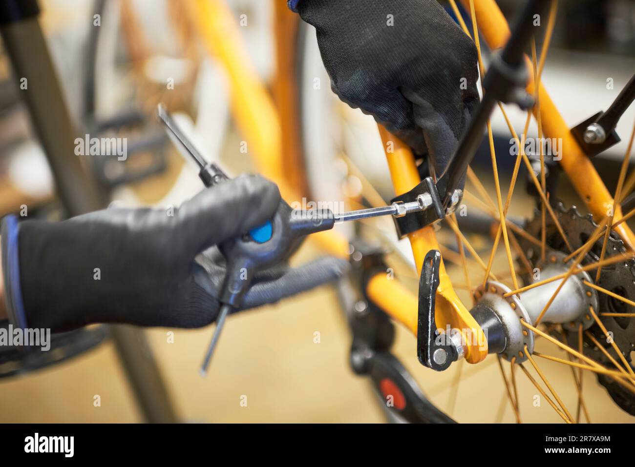 Maintenance of a bicycle: hands of an unrecognizable person using ...