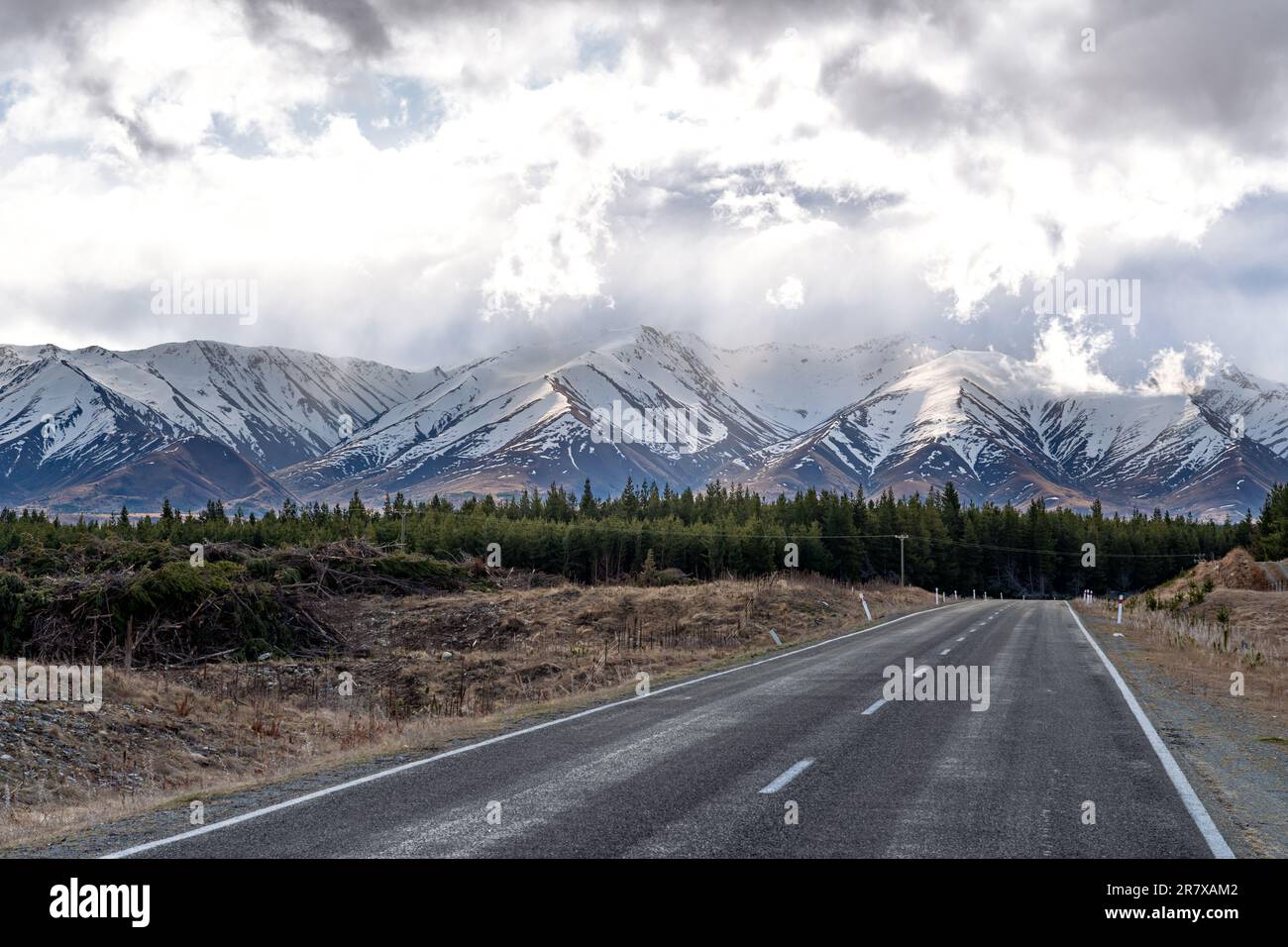 A scenic landscape of road to Aoraki Mount Cook - Lake Pukaki with blue ...