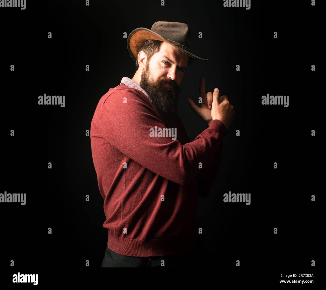 Cowboy man shouting with gun hand gesture. Sheriff or cowboy with ...