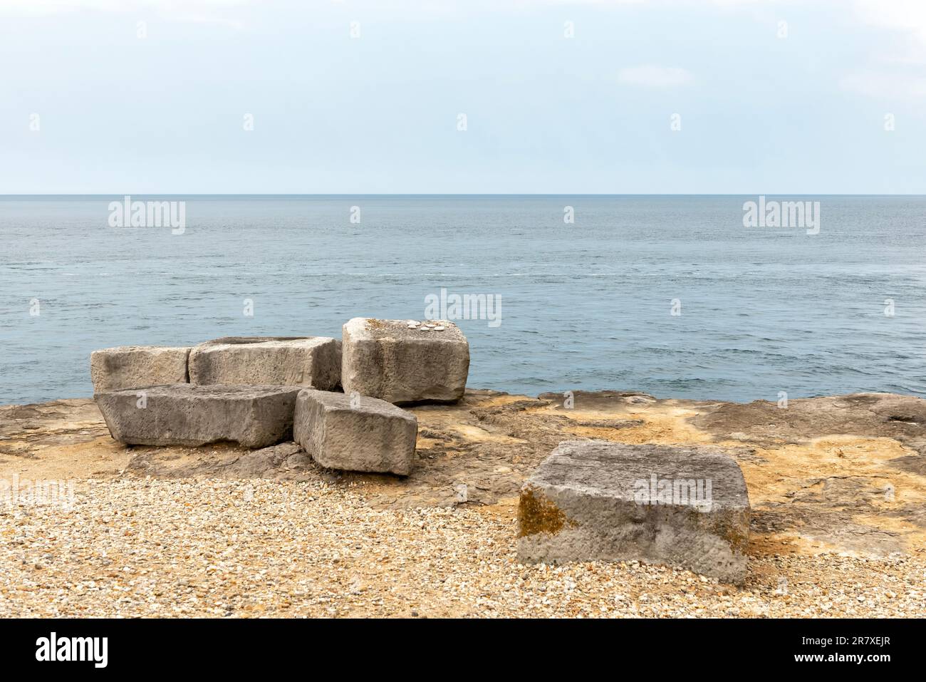 Stone benches facing the sea Stock Photo - Alamy