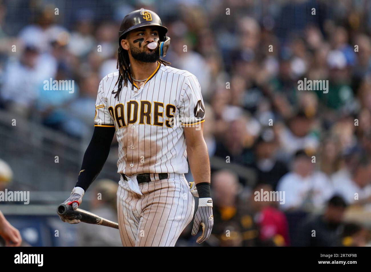 San Diego Padres' Fernando Tatis Jr. blows a bubble after striking out ...