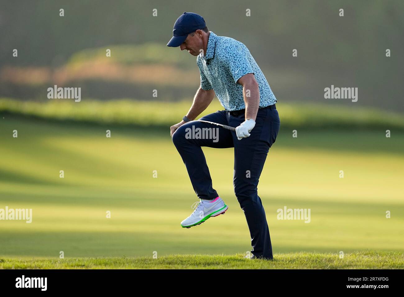 Rory McIlroy reacts after his shot from the rough on the 14th hole ...