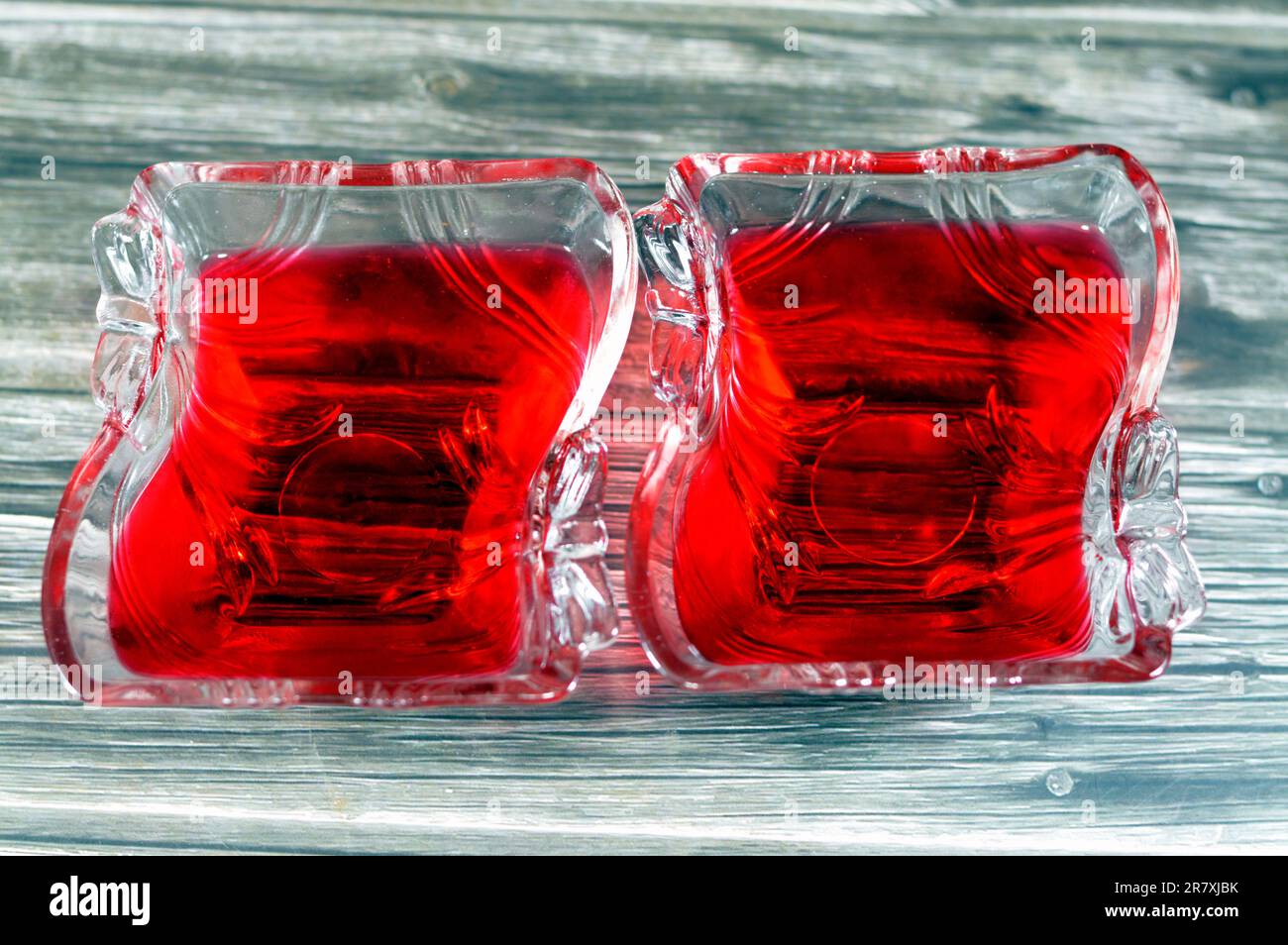 A close up of a delicious sweet red jelly pudding strawberry flavored ...