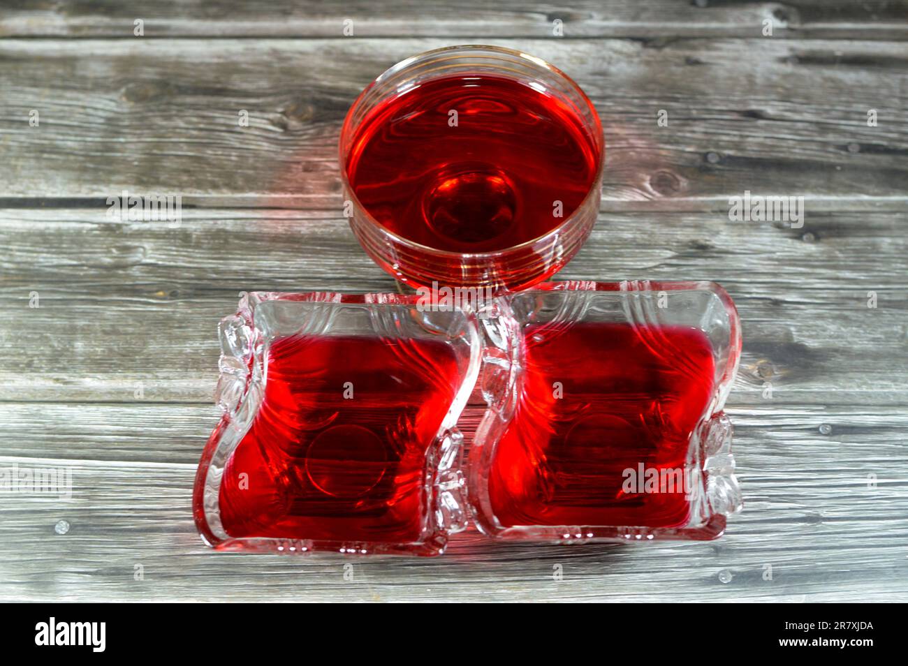 A close up of a delicious sweet red jelly pudding strawberry flavored ...