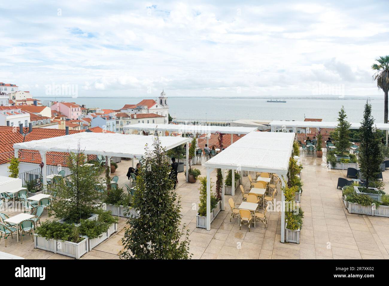 Al fresco dining on a deck with view of Ocean. Cafe terrace in Lisbon ...