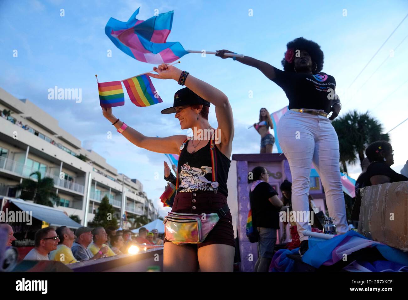 Ash Zantop, left, waves rainbow flags from a float sponsored by several ...