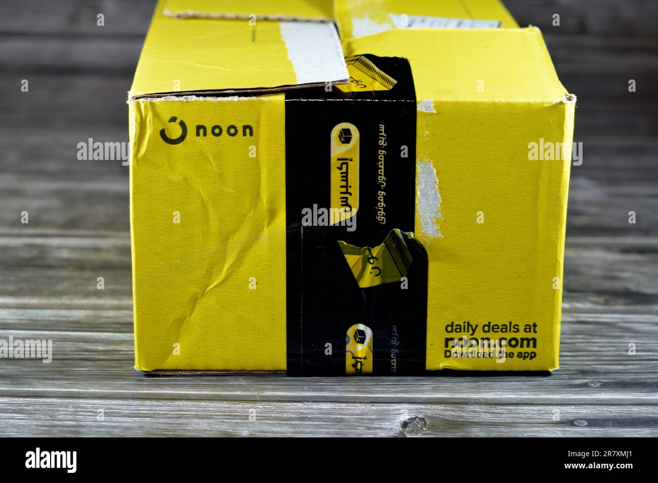 Cairo, Egypt, June 12 2023: Noon online shopping delivery yellow box ...