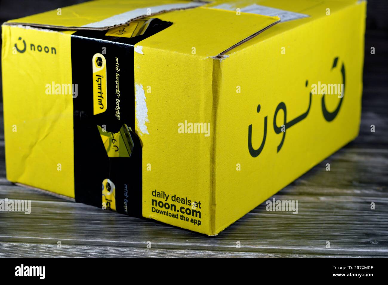 Cairo, Egypt, June 12 2023: Noon online shopping delivery yellow box ...