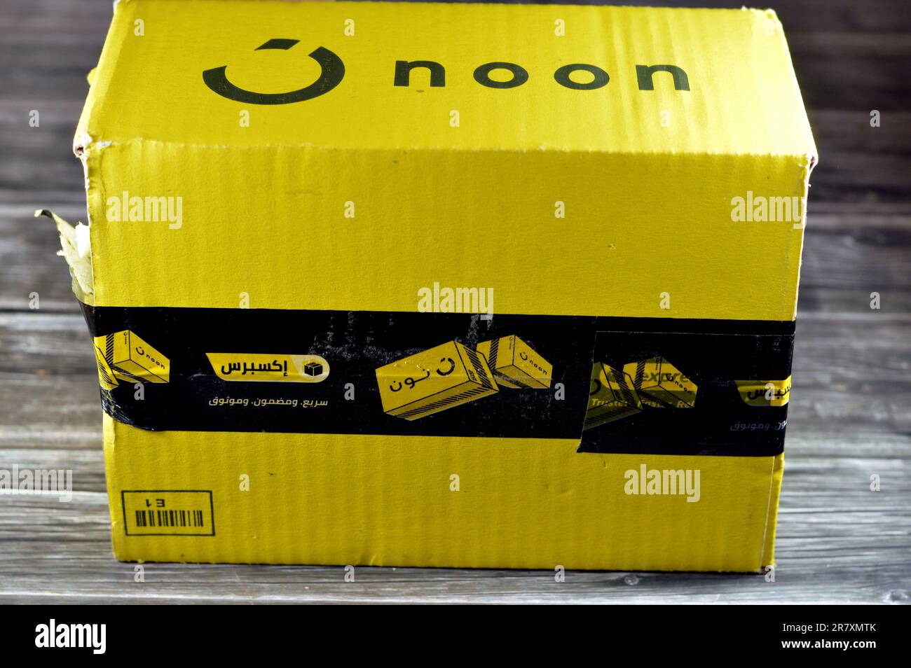 Cairo, Egypt, June 12 2023: Noon online shopping delivery yellow box ...