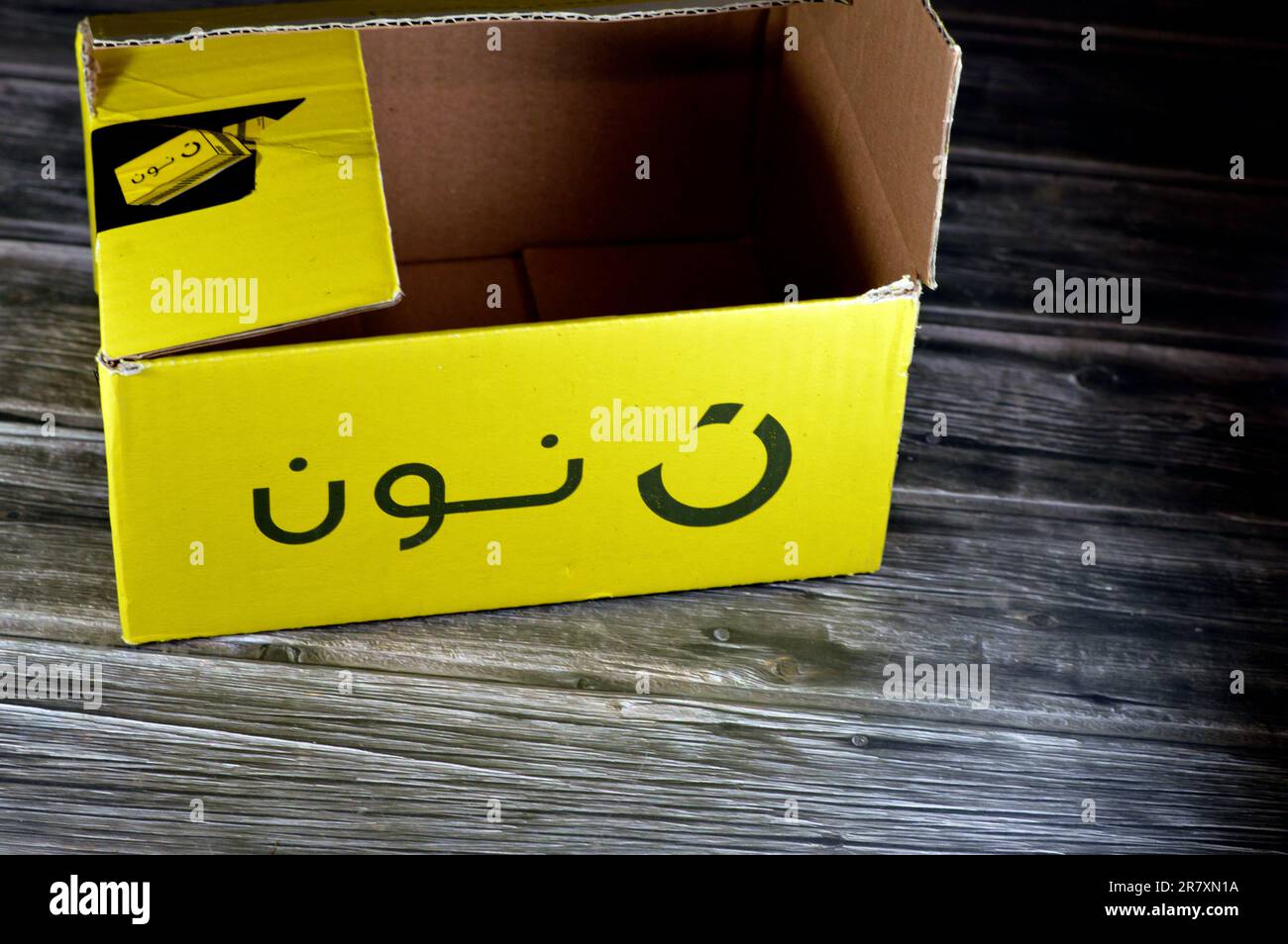 Cairo, Egypt, June 12 2023: Noon online shopping delivery yellow box ...