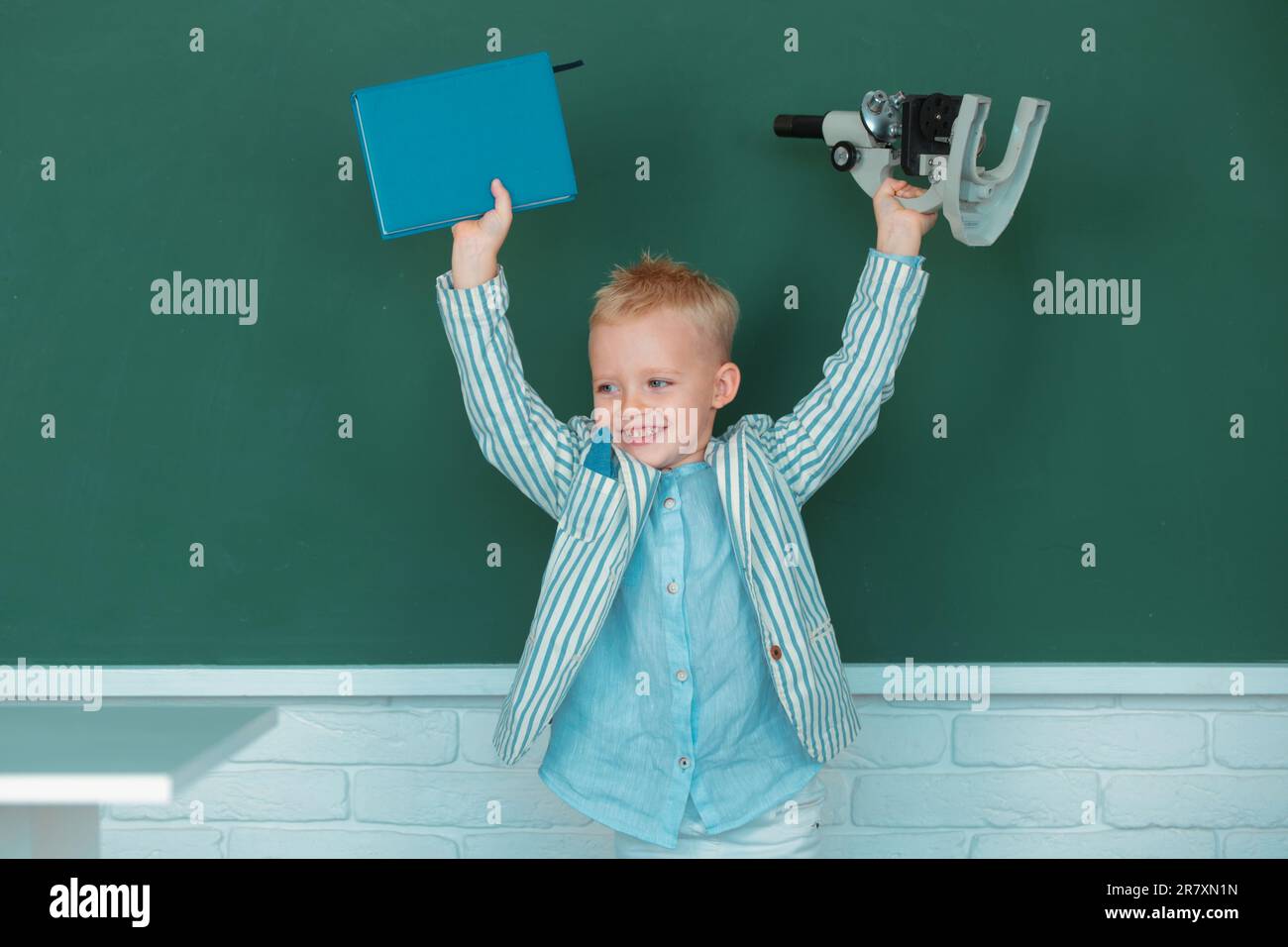 Back to school. Little schoolboy study in a classroom at elementary ...