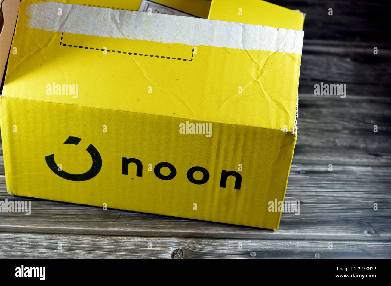 Cairo, Egypt, June 12 2023: Noon online shopping delivery yellow box ...