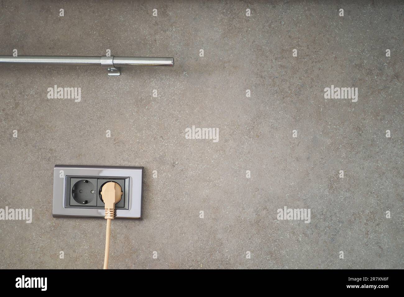 white color power cord cable plugged into wall Stock Photo - Alamy