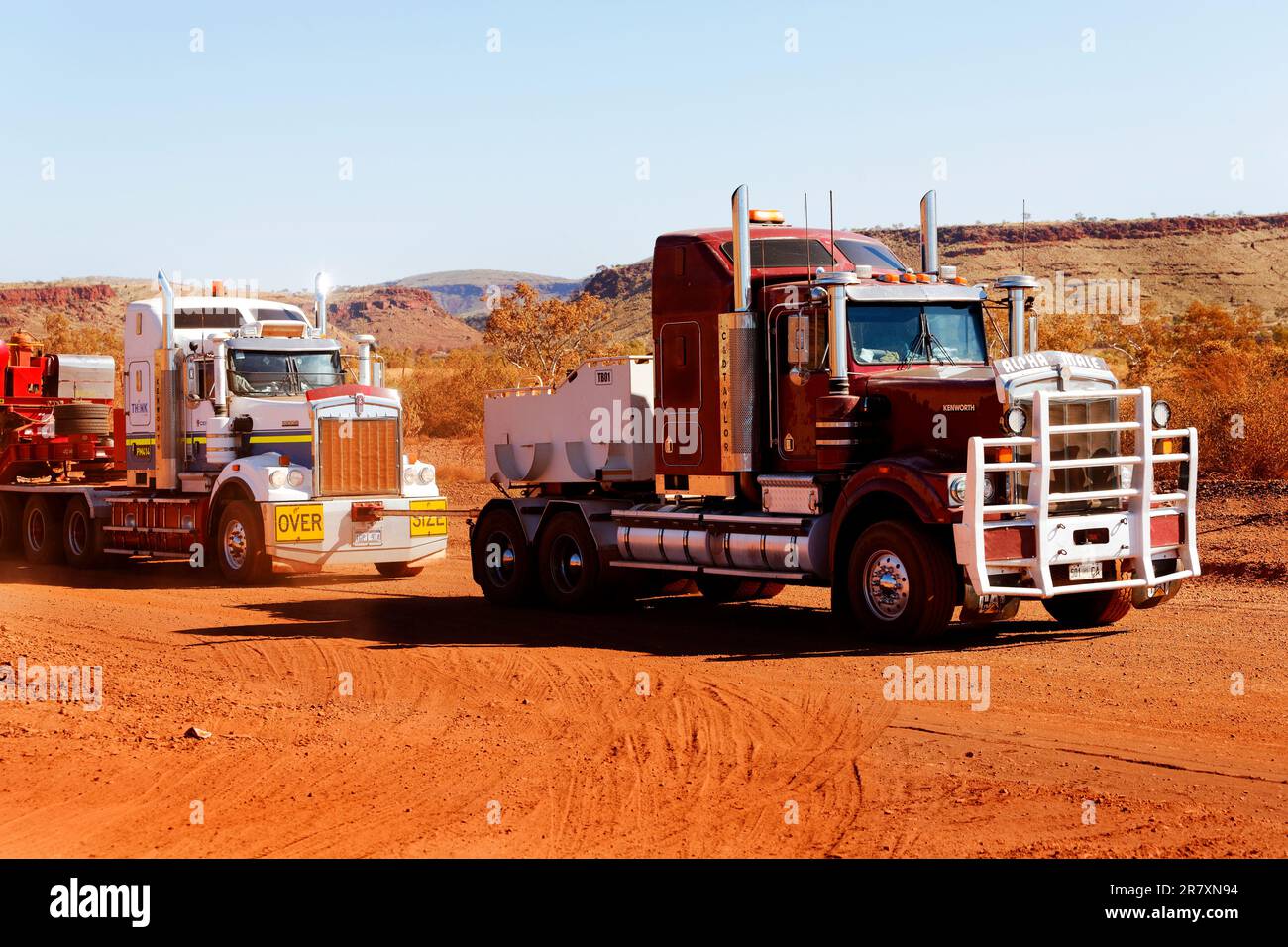 2 Kenworth prime mover trucks linked for towing heavy equipment on ...
