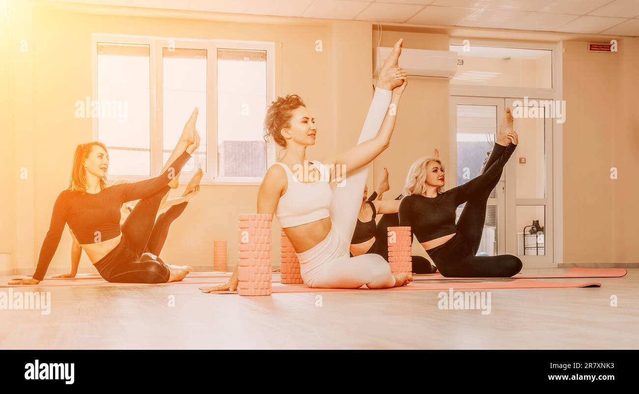 Happy middle aged well looking women, performing fascia exercises on ...